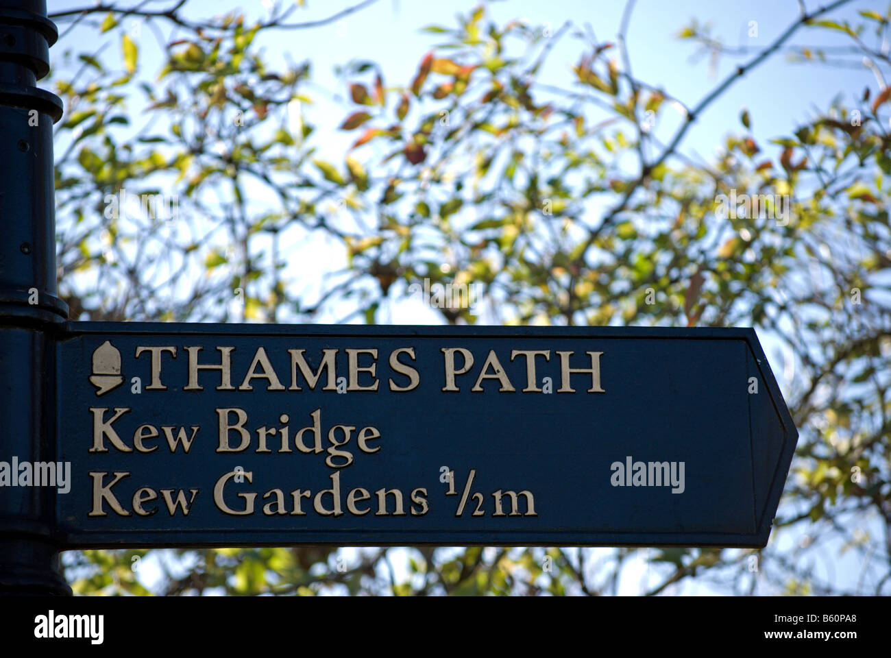 sign on the thames path showing directions to kew bridge and kew ...