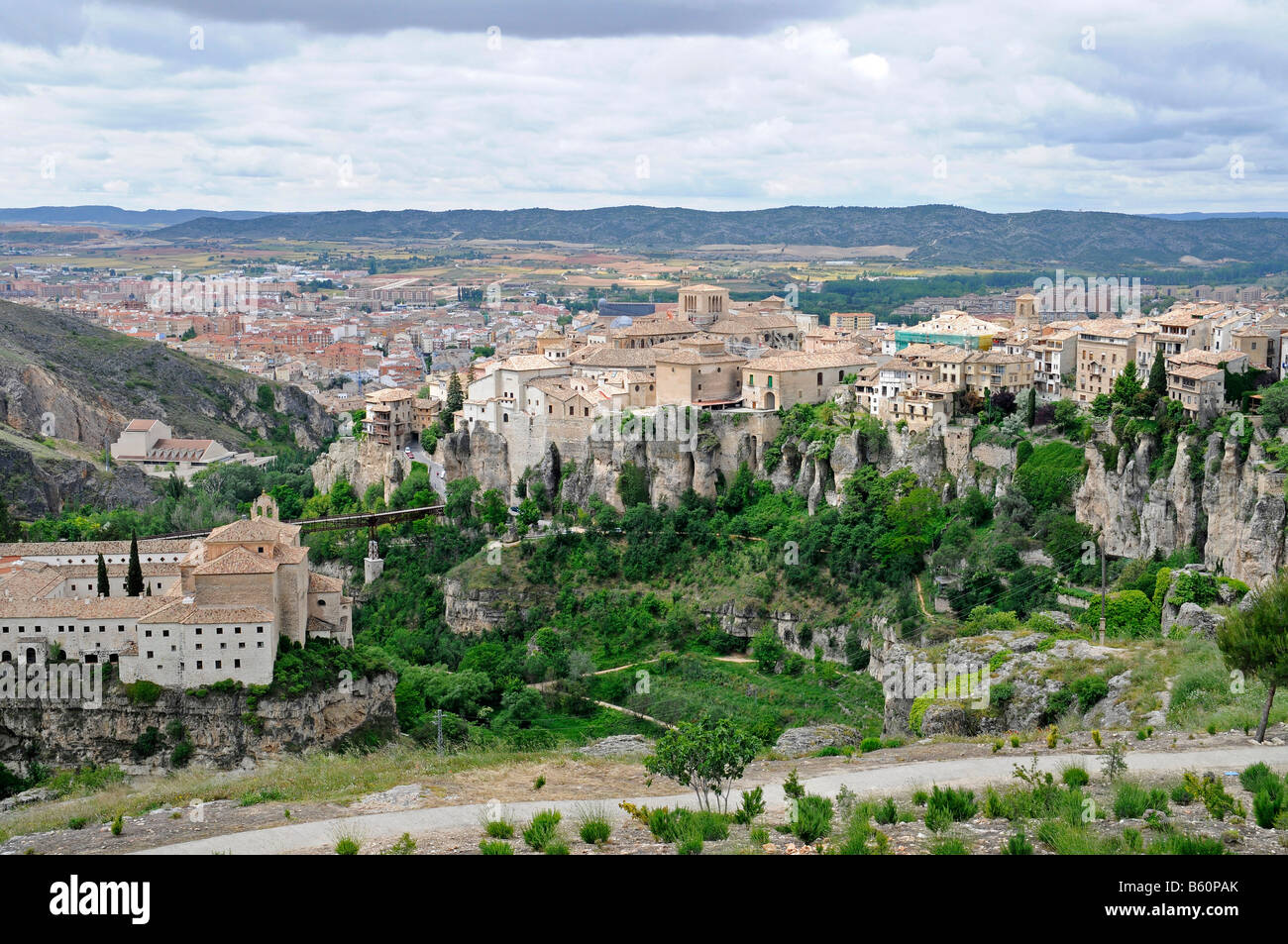 View over the valley and city with houses and Hotel Parador, Cuenca ...