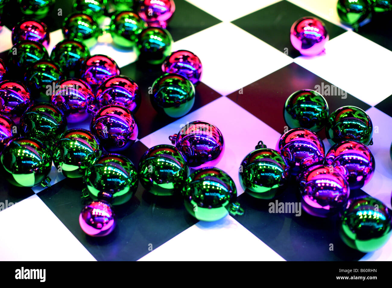 Christmas baubles in store window display Stock Photo - Alamy