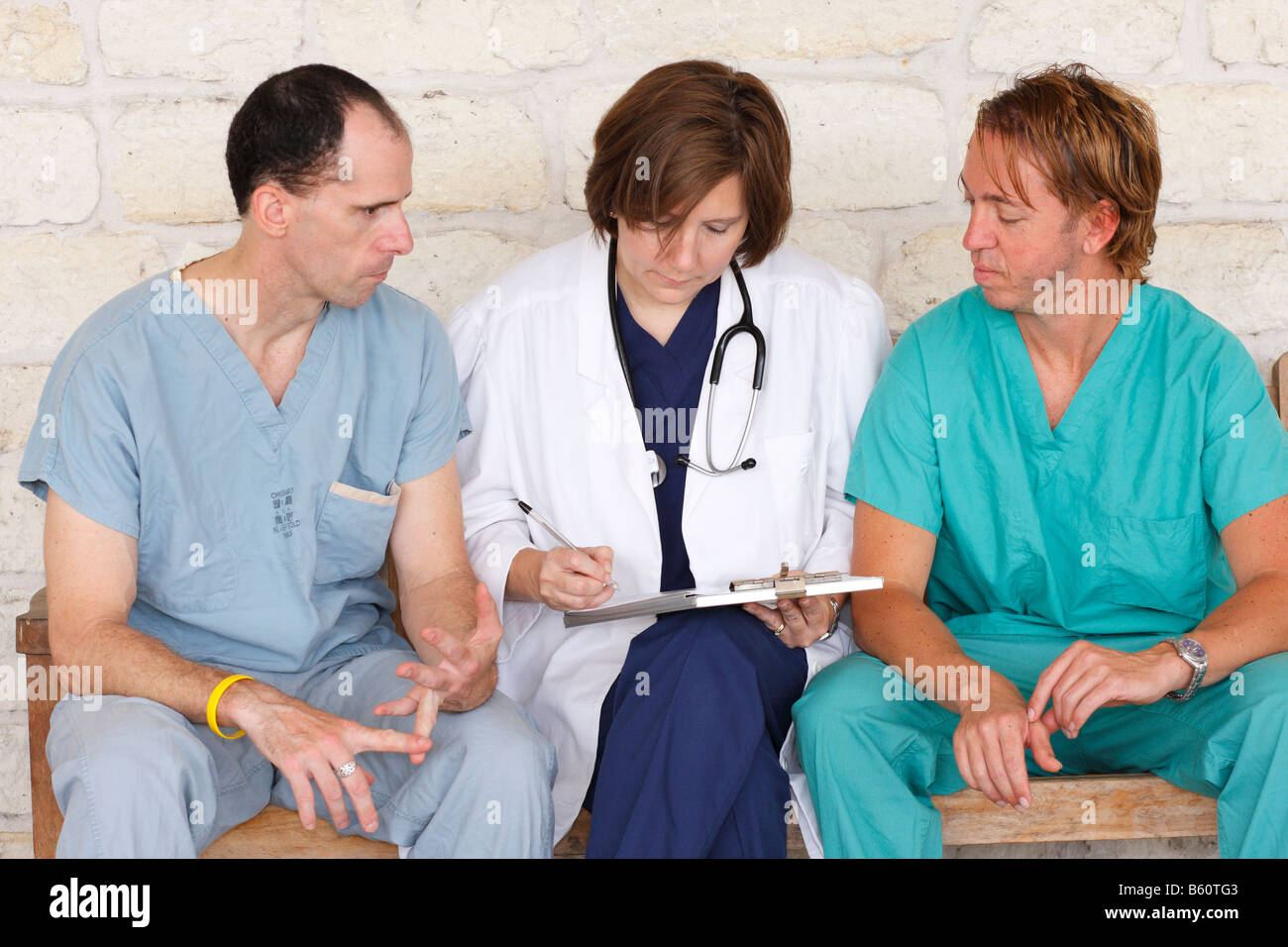 Medical doctor sitting on bench hi-res stock photography and images - Alamy