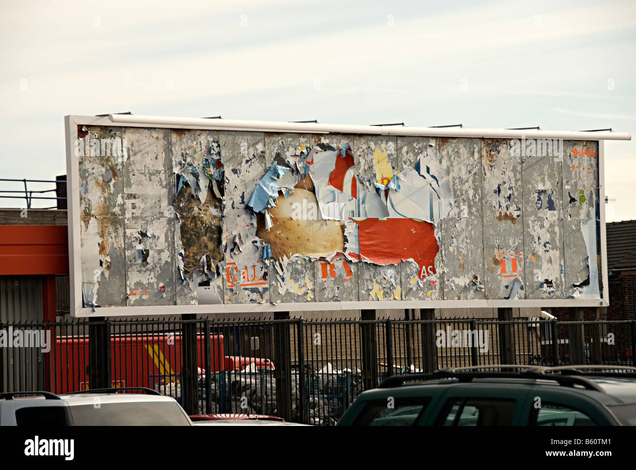 a torn advertising sign ripped in stoke on trent uk Stock Photo - Alamy
