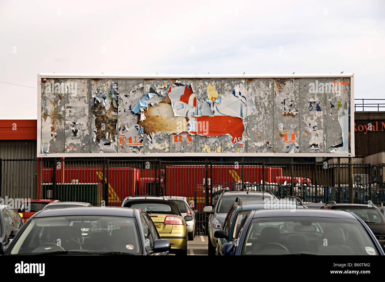 a torn advertising sign ripped in stoke on trent uk Stock Photo - Alamy