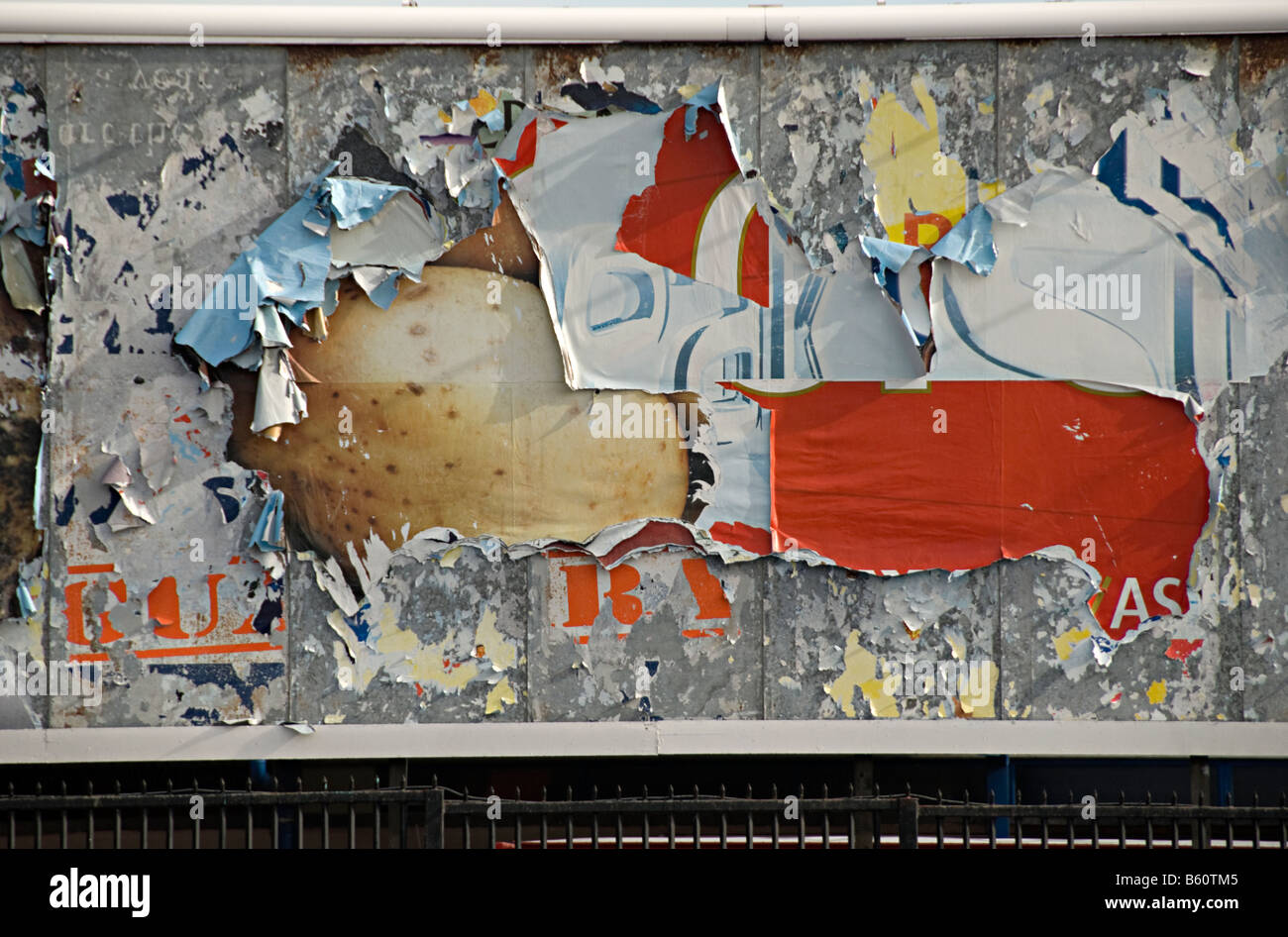 a torn advertising sign ripped in stoke on trent uk Stock Photo - Alamy