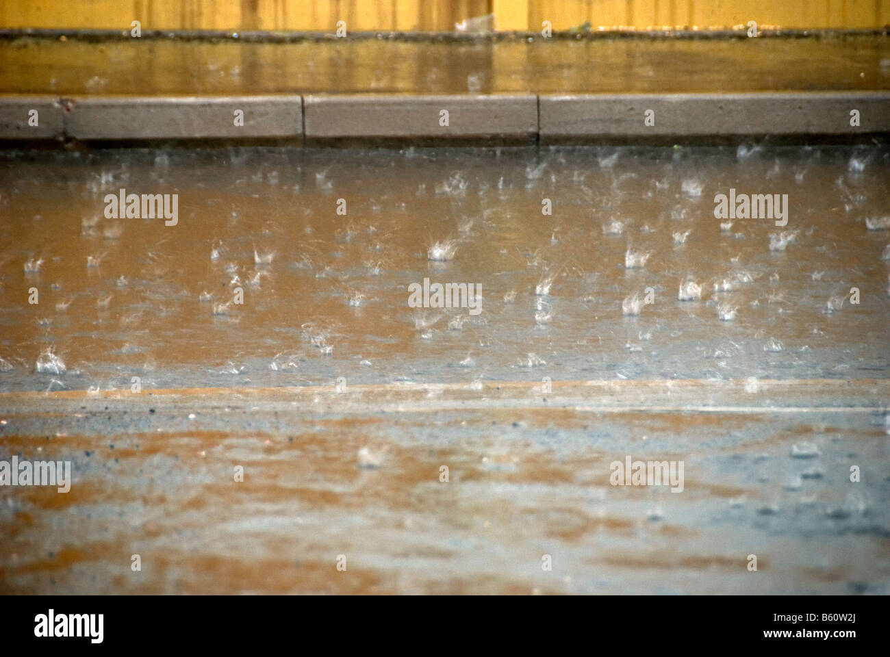 very heavy rain falling on the roadside Stock Photo - Alamy
