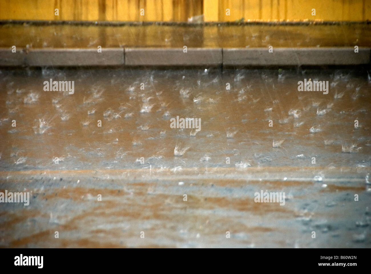 very heavy rain falling on the roadside Stock Photo - Alamy