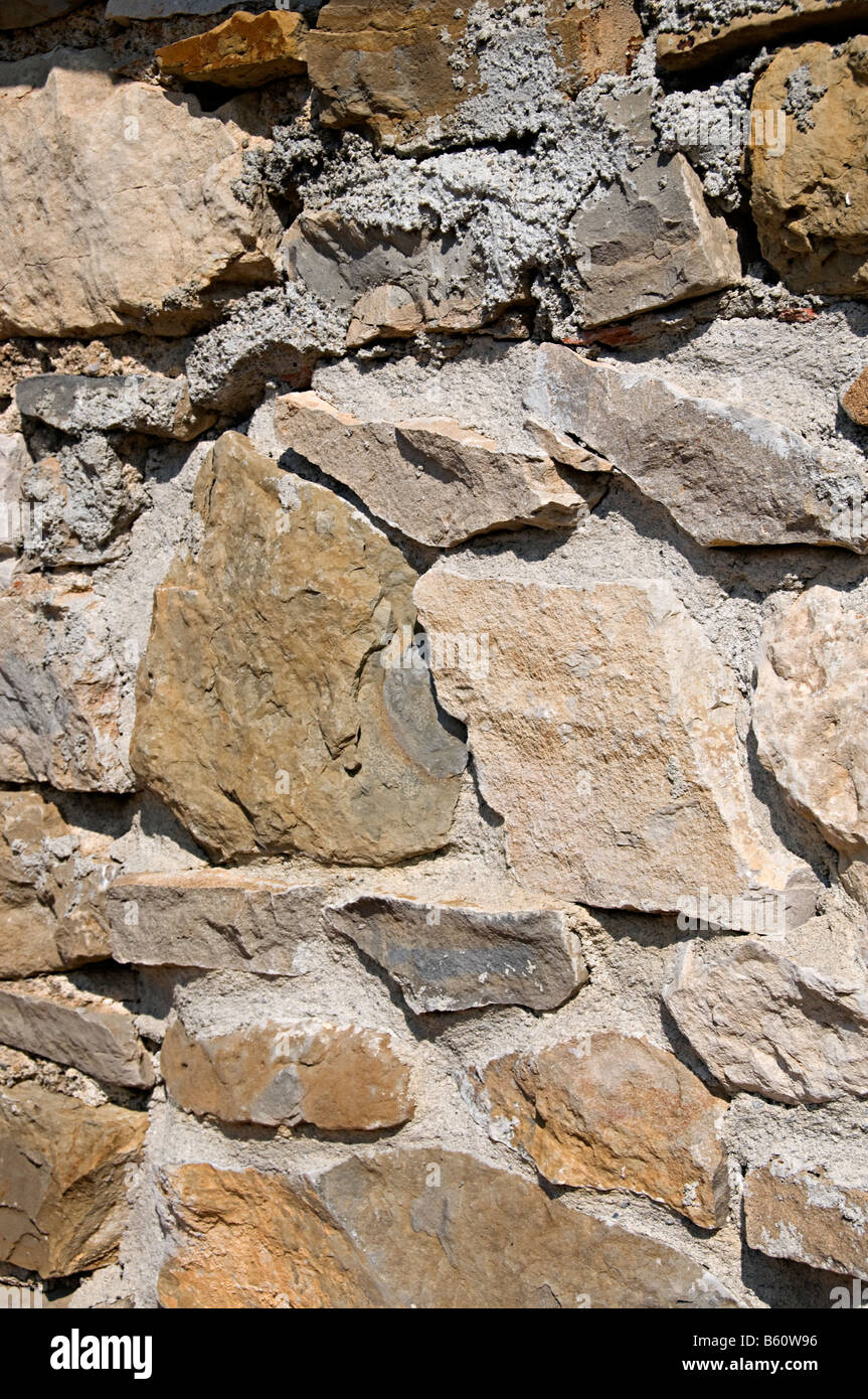 a typical stone wall of a converted barn in france Stock Photo - Alamy