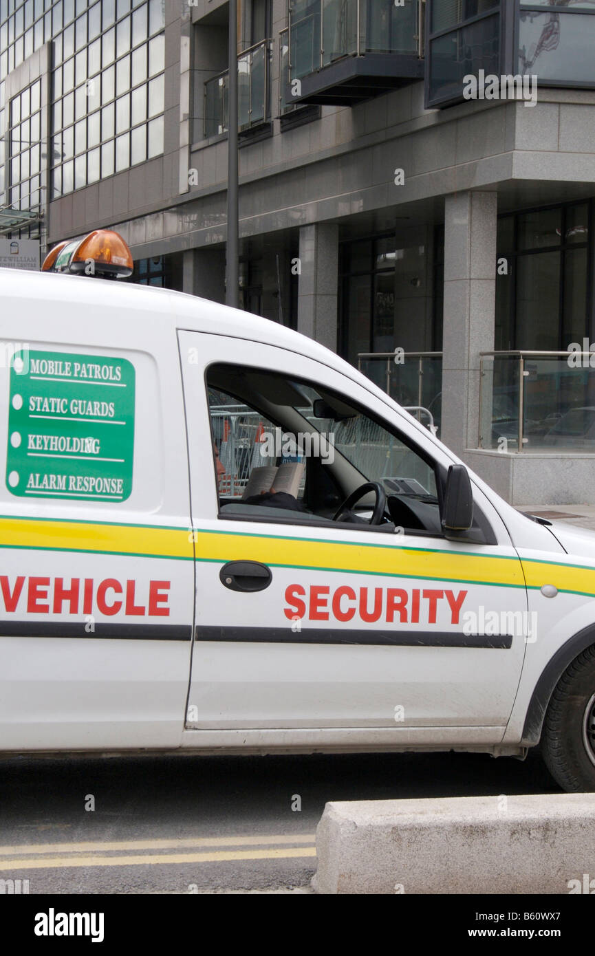 Man reading book inside security van in Dublin Ireland Stock Photo - Alamy
