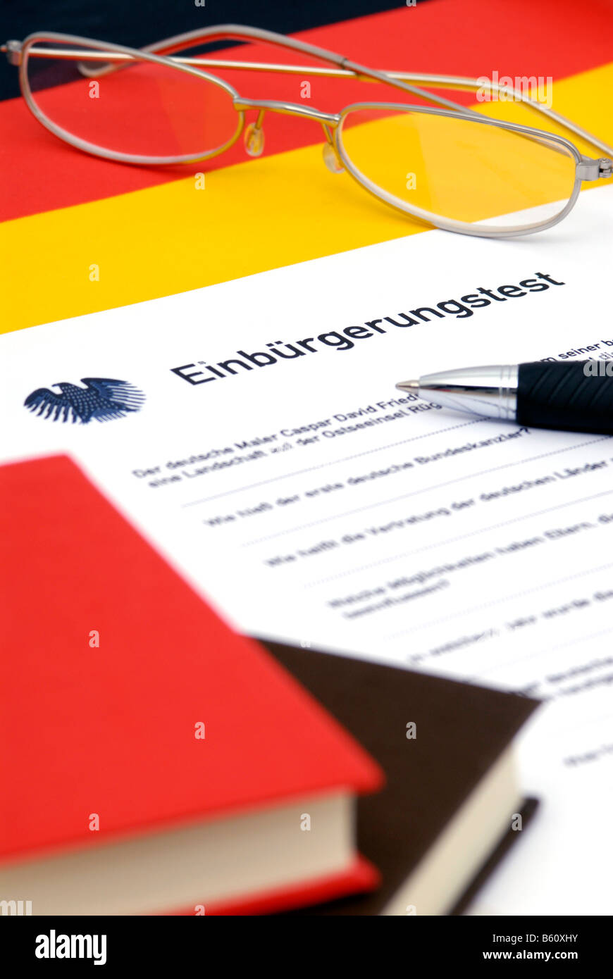 German naturalisation test and a German flag, symbolic image for ...