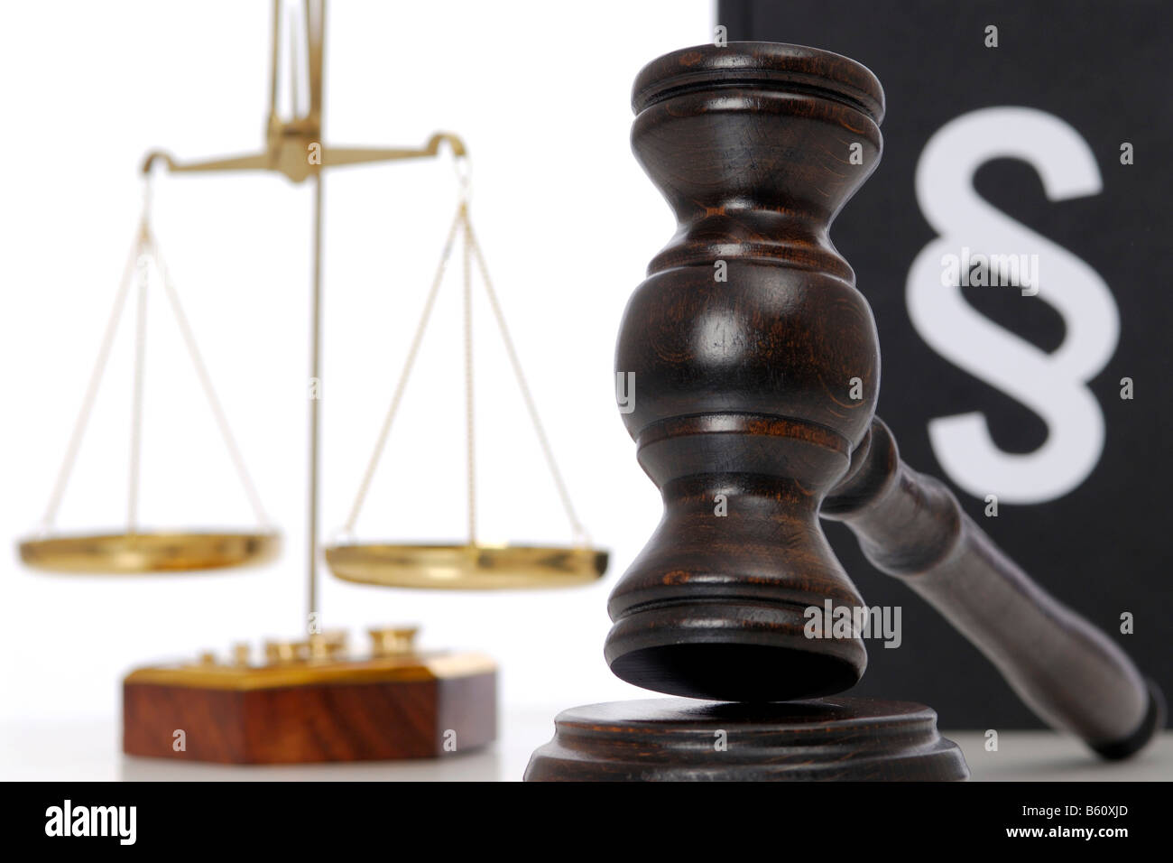 Judge's gavel in front a pair of scales and a law book, symbolic image ...