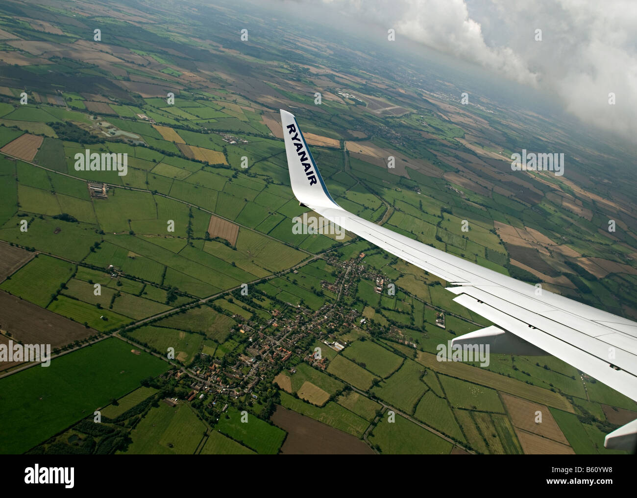airplane wing in flight of a boeing 737 800 of a Ryanair plane with ...