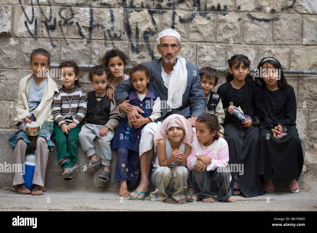 Old man, 70-75 years old surrounded by children, San a , Yemen, Middle ...