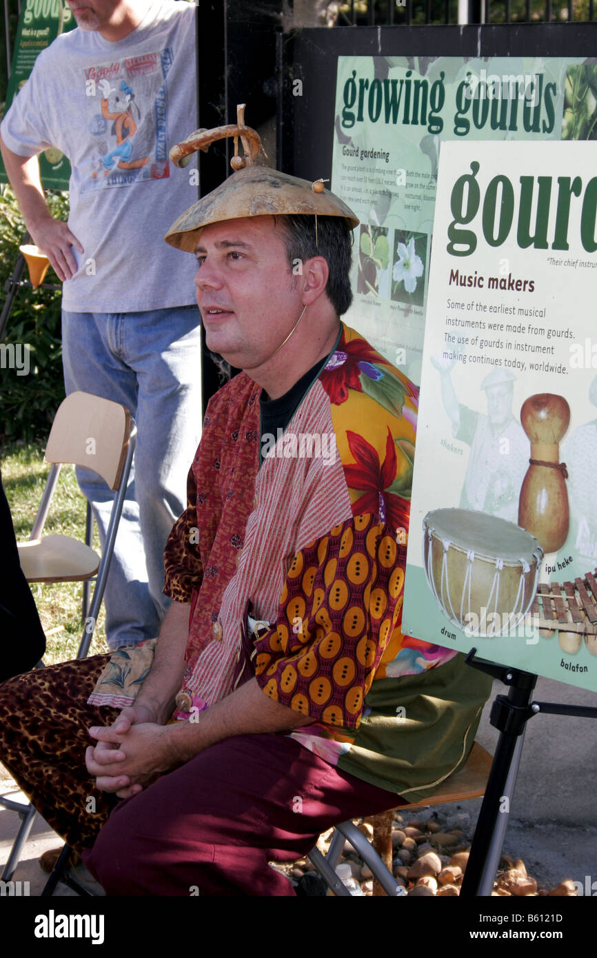 Man illustrating the importance of gourds in music history, for drums ...
