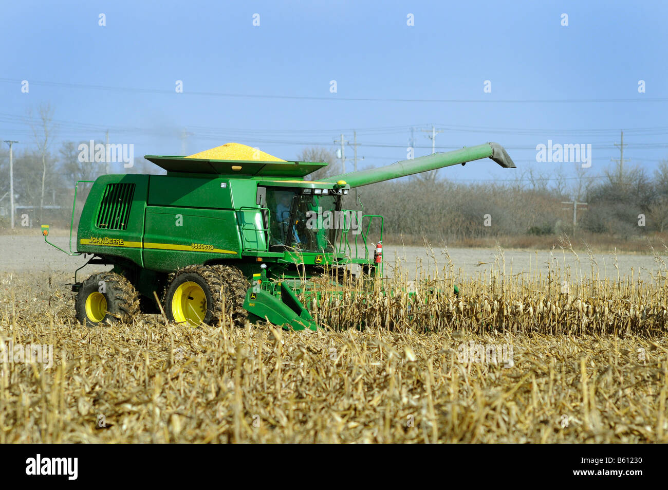 A John Deere combine harvests a corn crop in the USA Stock Photo - Alamy