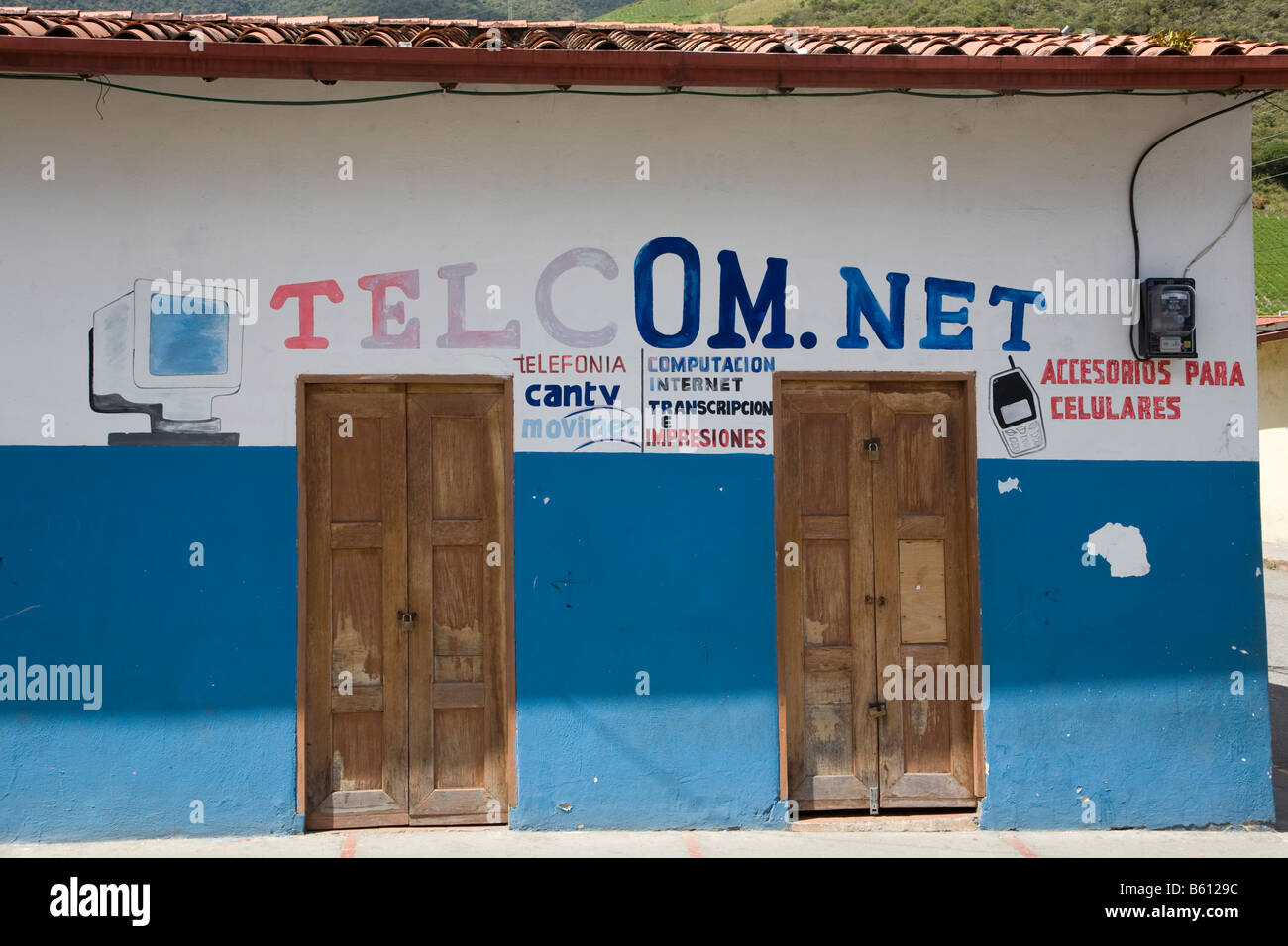Telecommunications, painted signage on a facade, Venezula, South ...