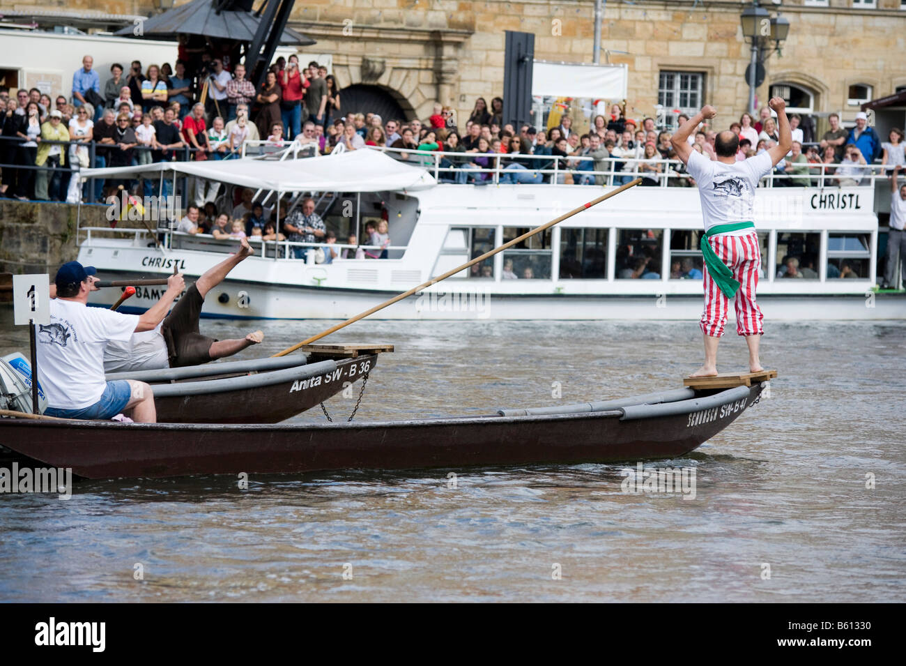Men on boat taking part in the traditional fisherman jousting on the ...