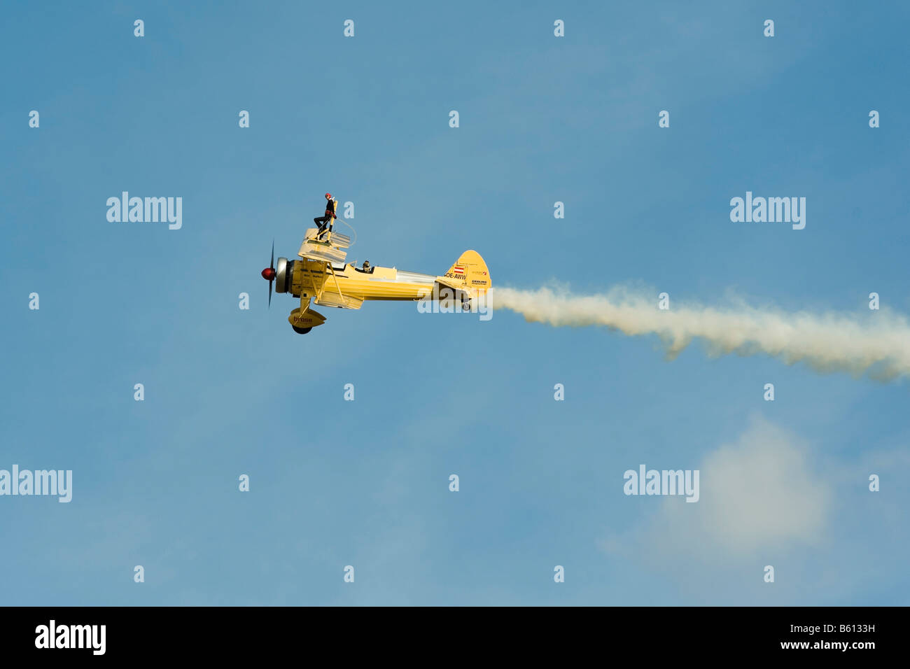 Biplane with a wing-walker Stock Photo - Alamy