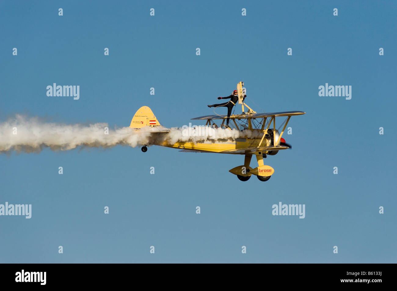 Biplane with a wing-walker Stock Photo - Alamy
