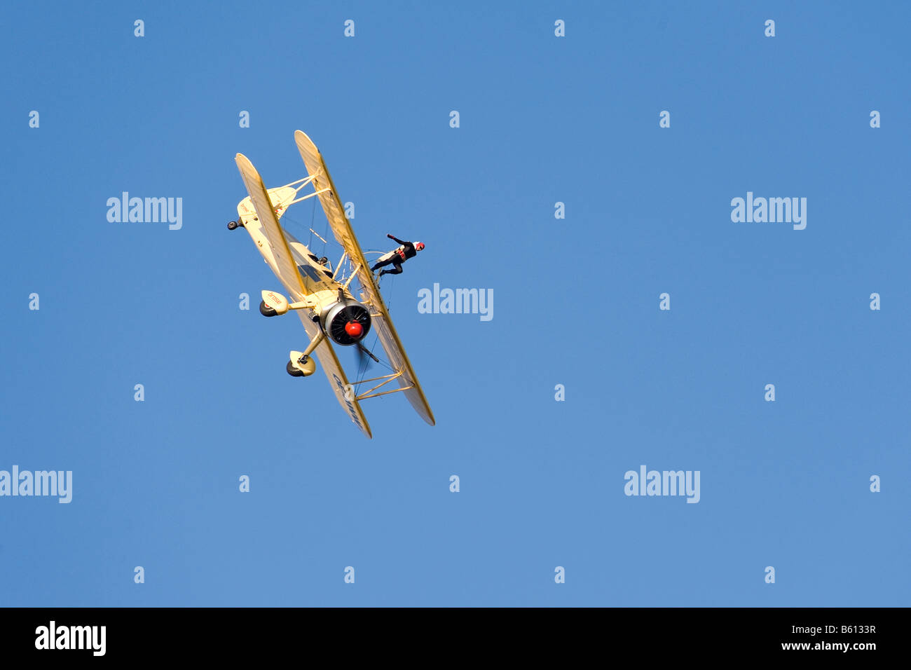 Biplane with a wing-walker Stock Photo - Alamy