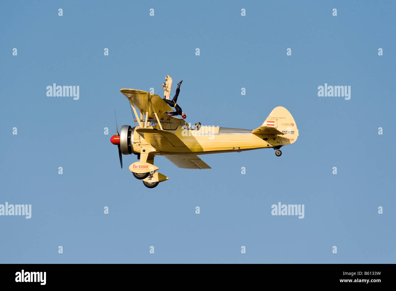 Biplane with a wing-walker Stock Photo - Alamy