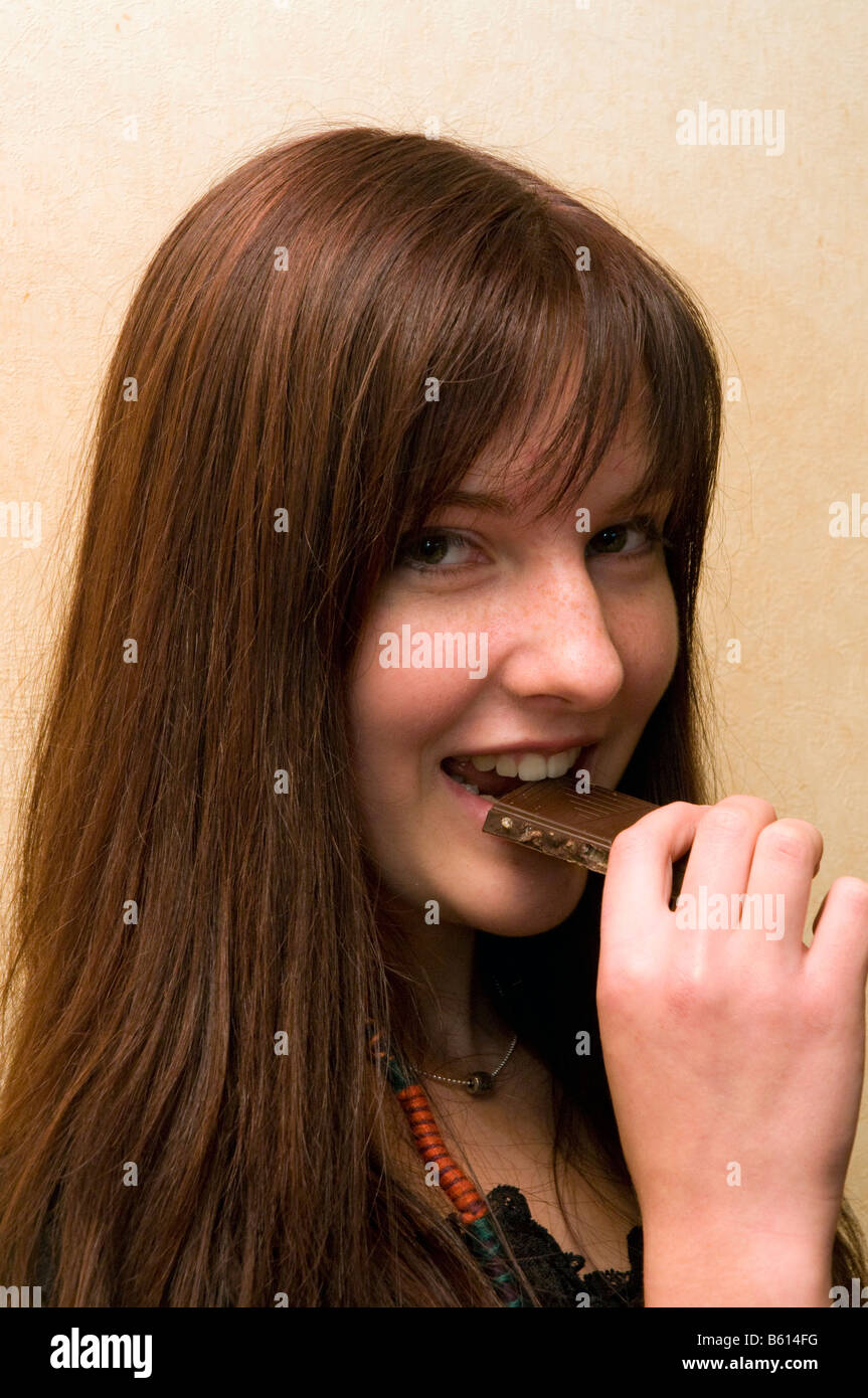 Chocolate lover Natalie about to attack a piece of chocolate Stock ...