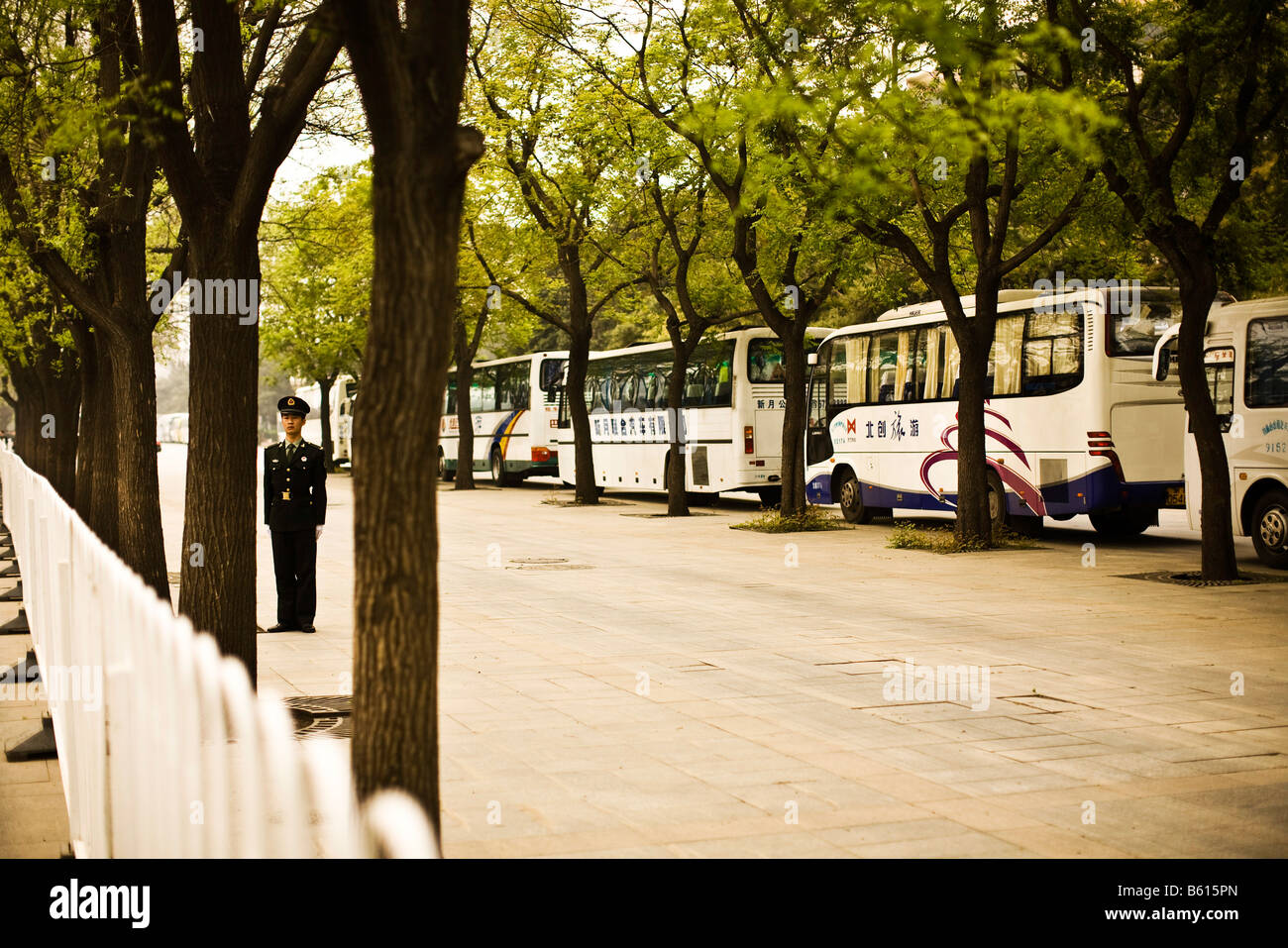 A soldier stands near tourist buses in Beijing China in April 2008 ...