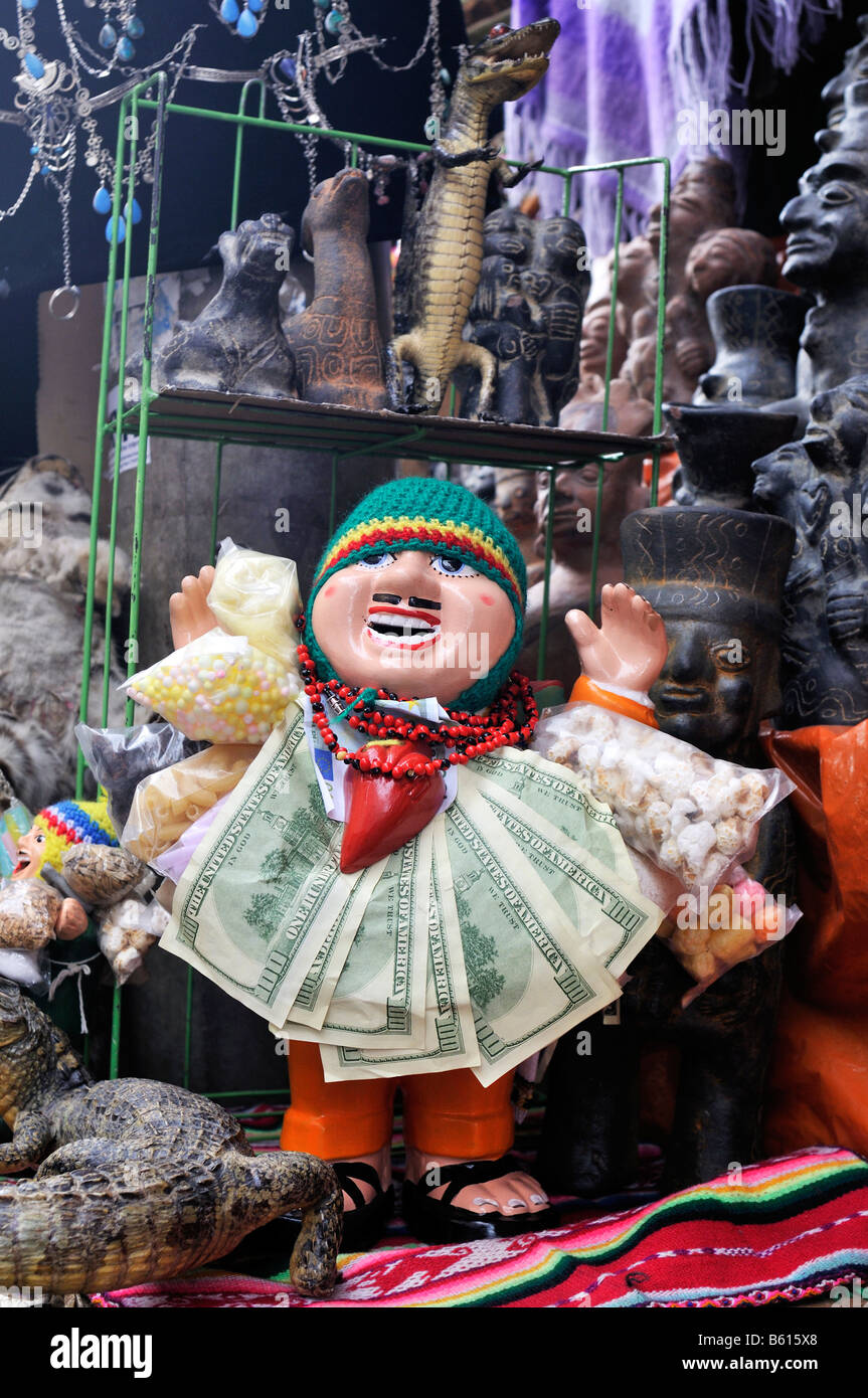 Puppet of a man with cash notes, lucky charm at the stall of a witch ...