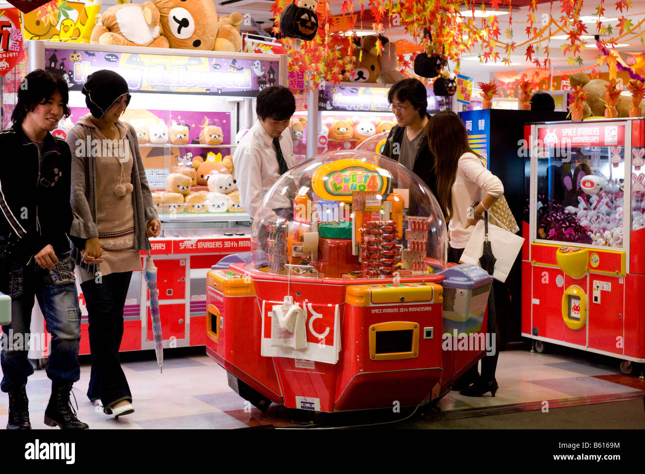 Young Japanese in an arcade shop in Shinjuku, Tokyo, Japan Stock Photo ...