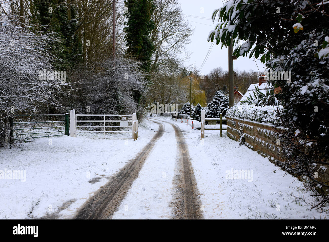 Road crossing a cattle grid during snowfall in the "British Countryside ...