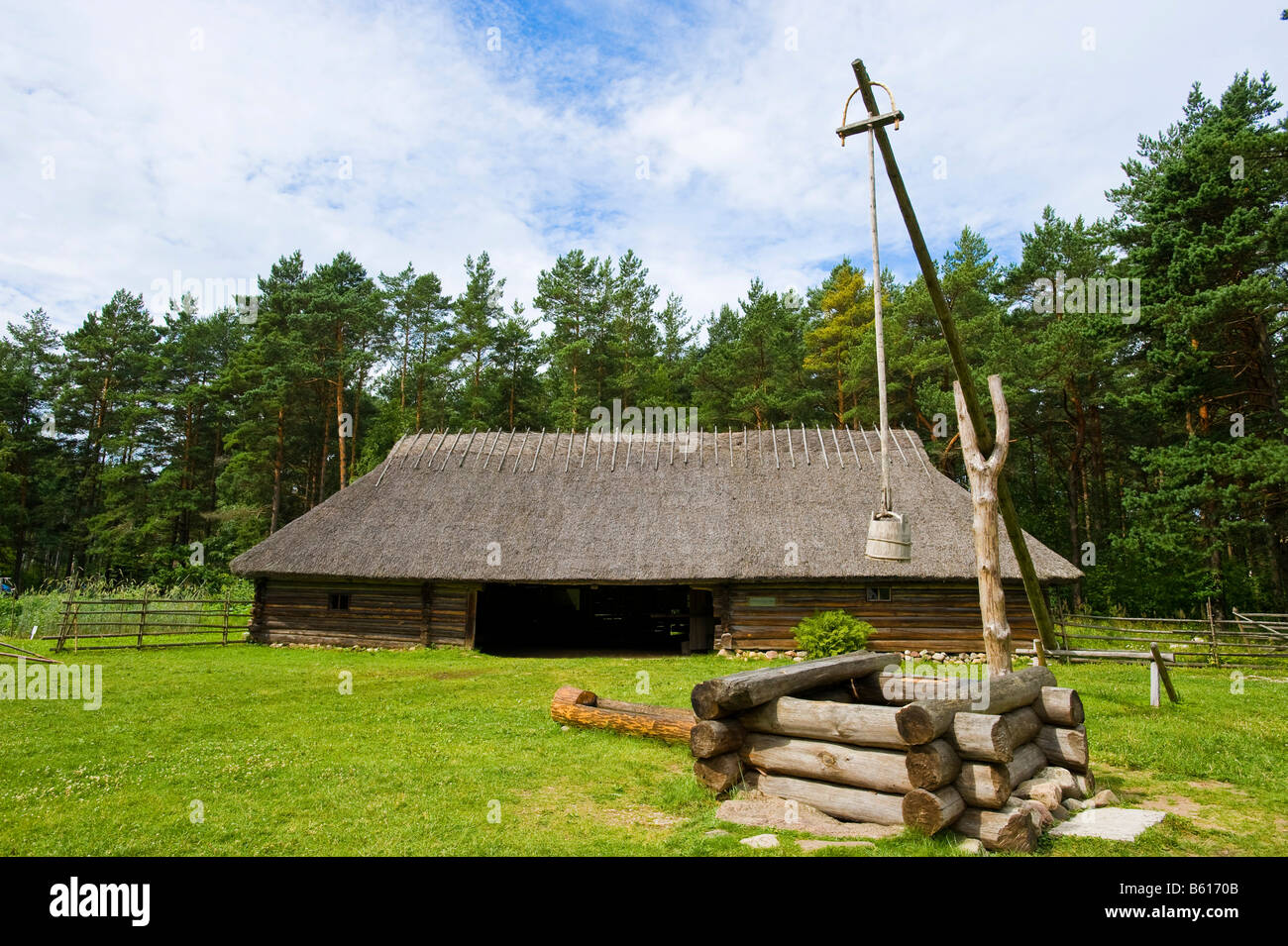 Draw well in front of a thatched wooden stable, Open Air Museum ...