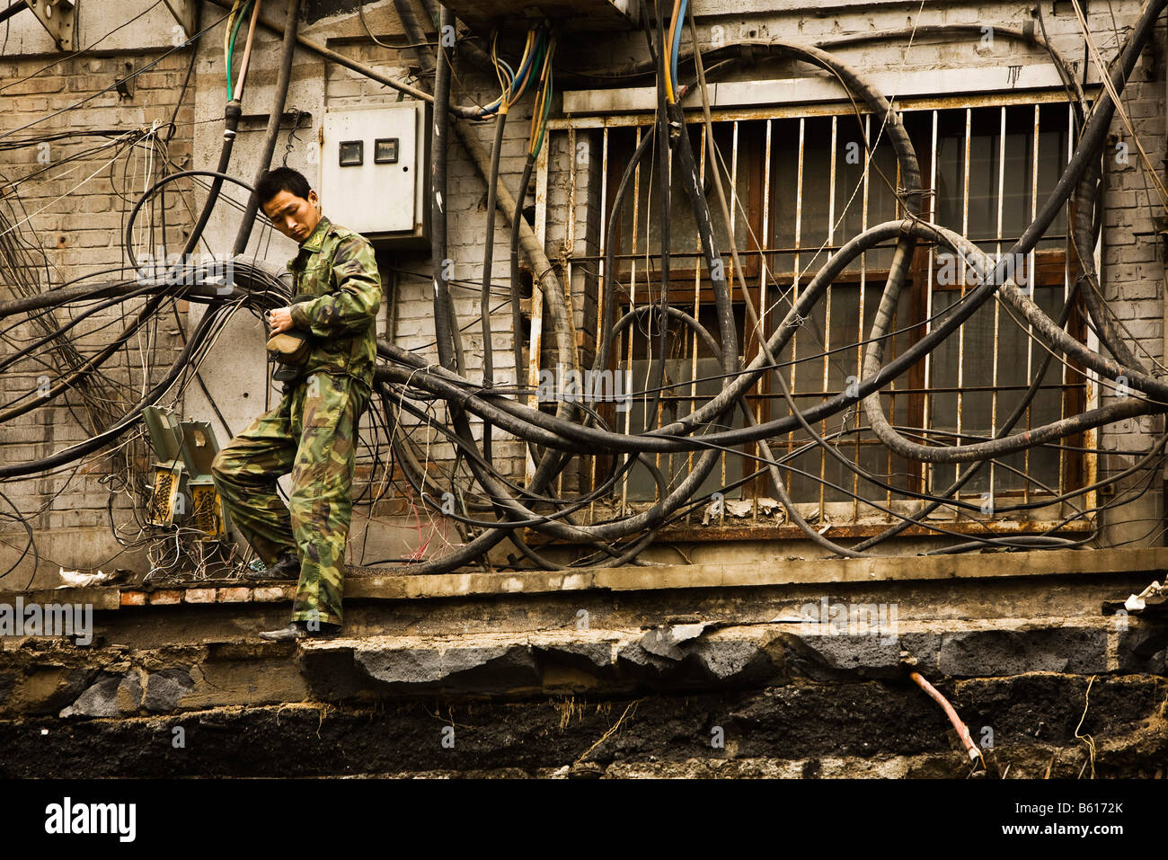 Man works on building electricity hi-res stock photography and images ...