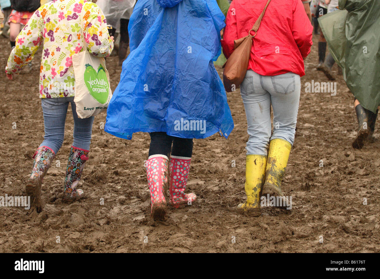 Glastonbury Rock Festival June 2008 fans walk across mud muddy ...