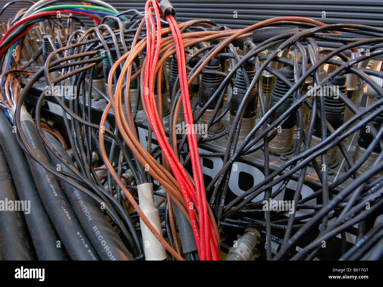 Jumble of cables behind a mixer in a sound studio Stock Photo - Alamy