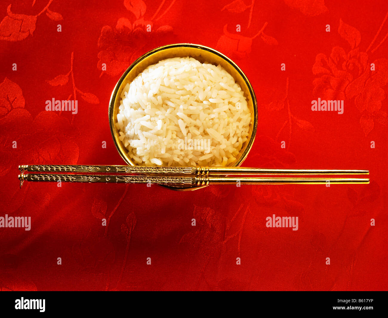 a bowl of rice on red background Stock Photo - Alamy