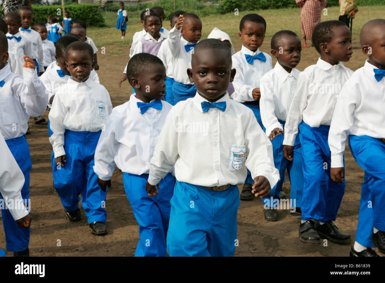 Pre-school children wearing uniforms during morning exercise, Buea ...