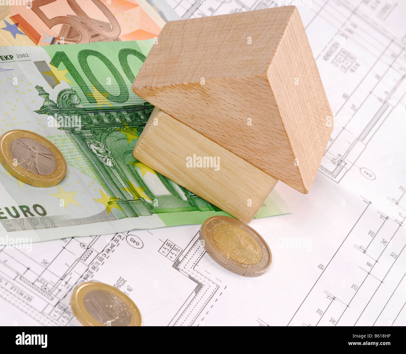 A little house on a building plan and Euro notes, symbolic picture for ...