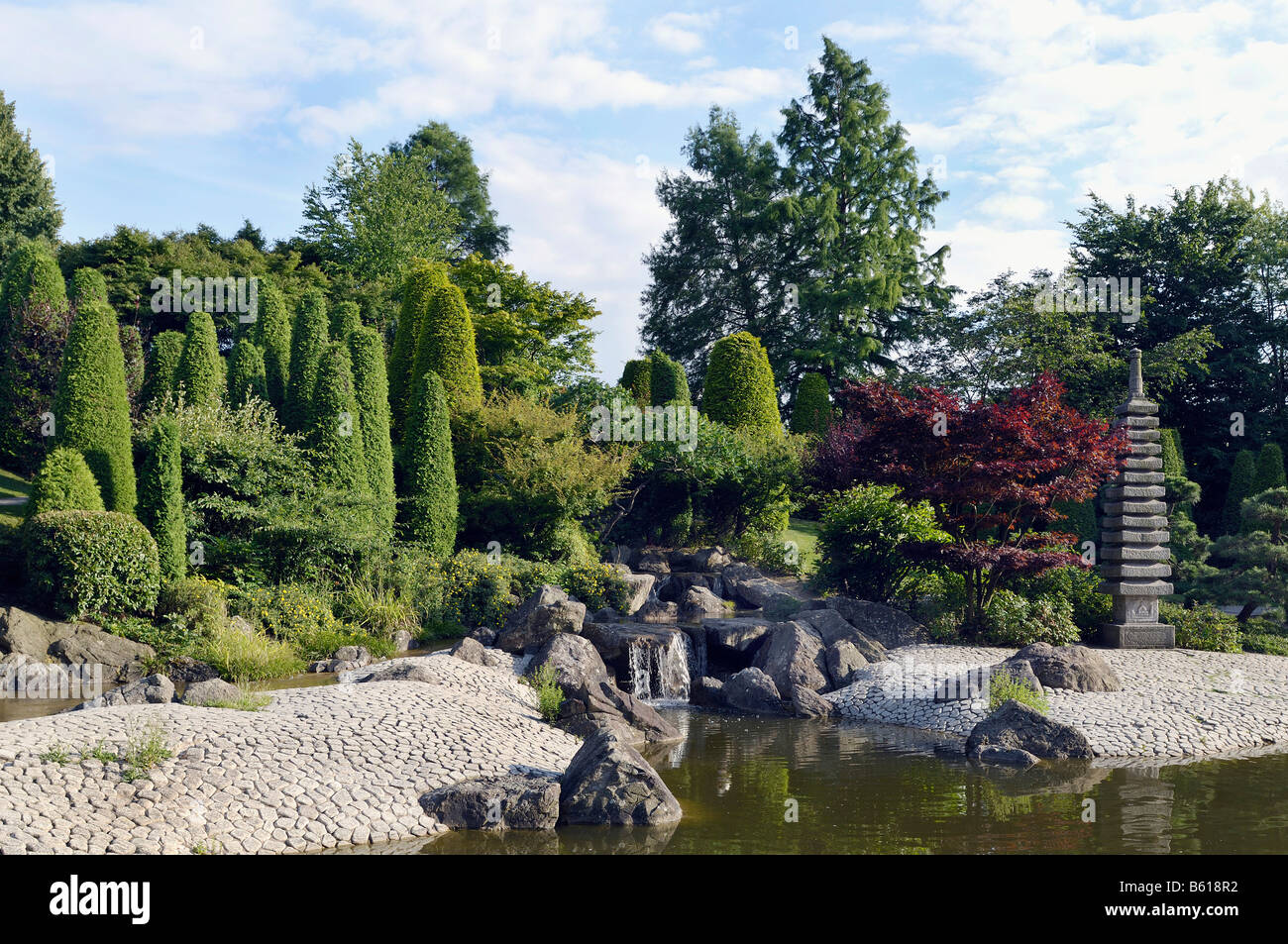 Japanese garden with a waterfall in Rheinaue Park, Bonn, North Rhine ...