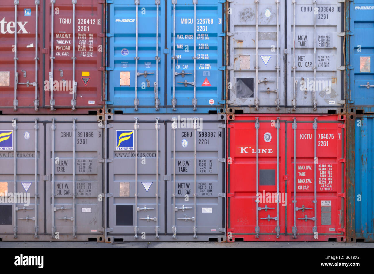 Various stacked overseas containers, format-filling Stock Photo - Alamy