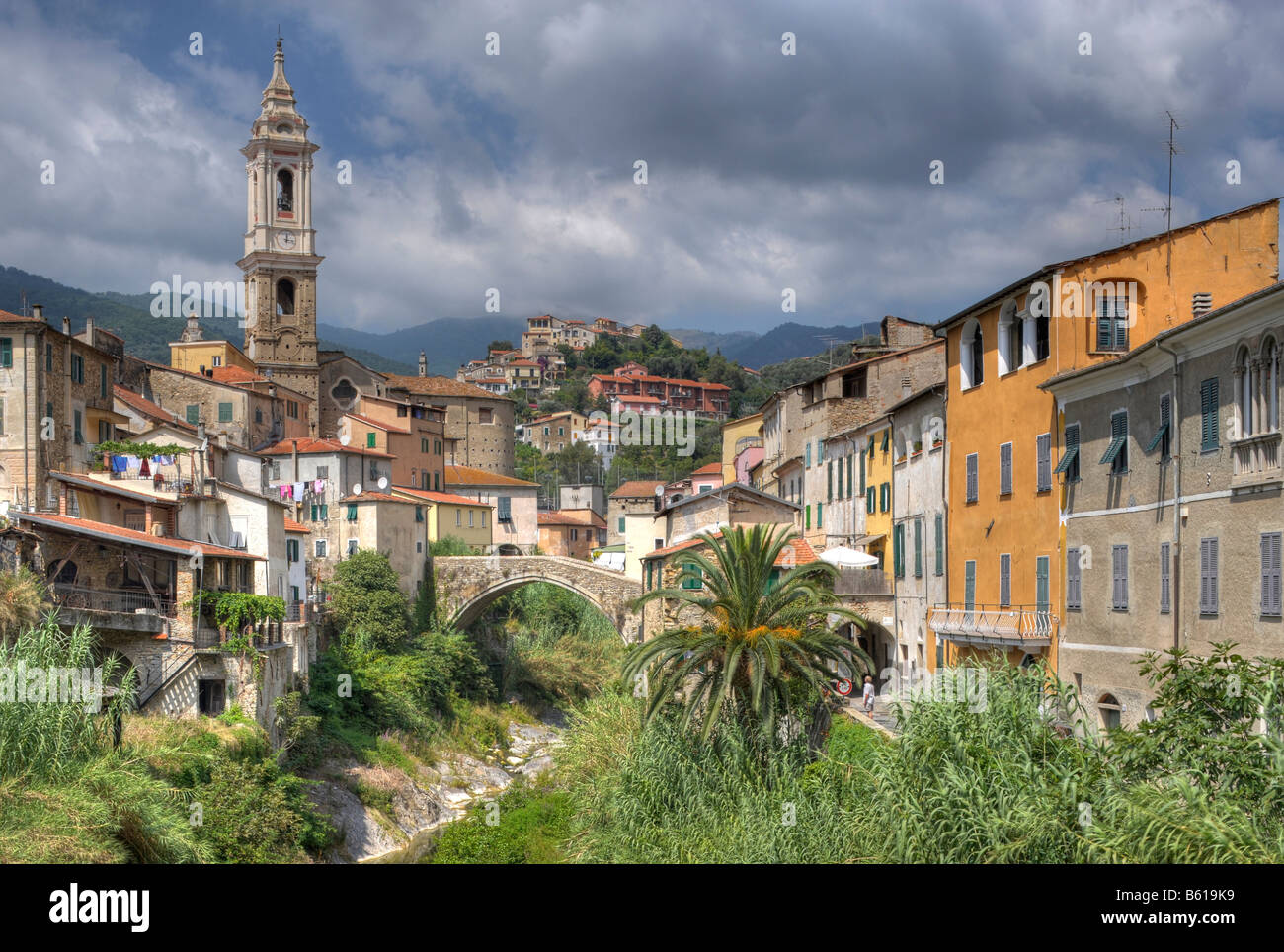 San Tomaso parish church in Dolcedo with the Ponte Grande Bridge over ...