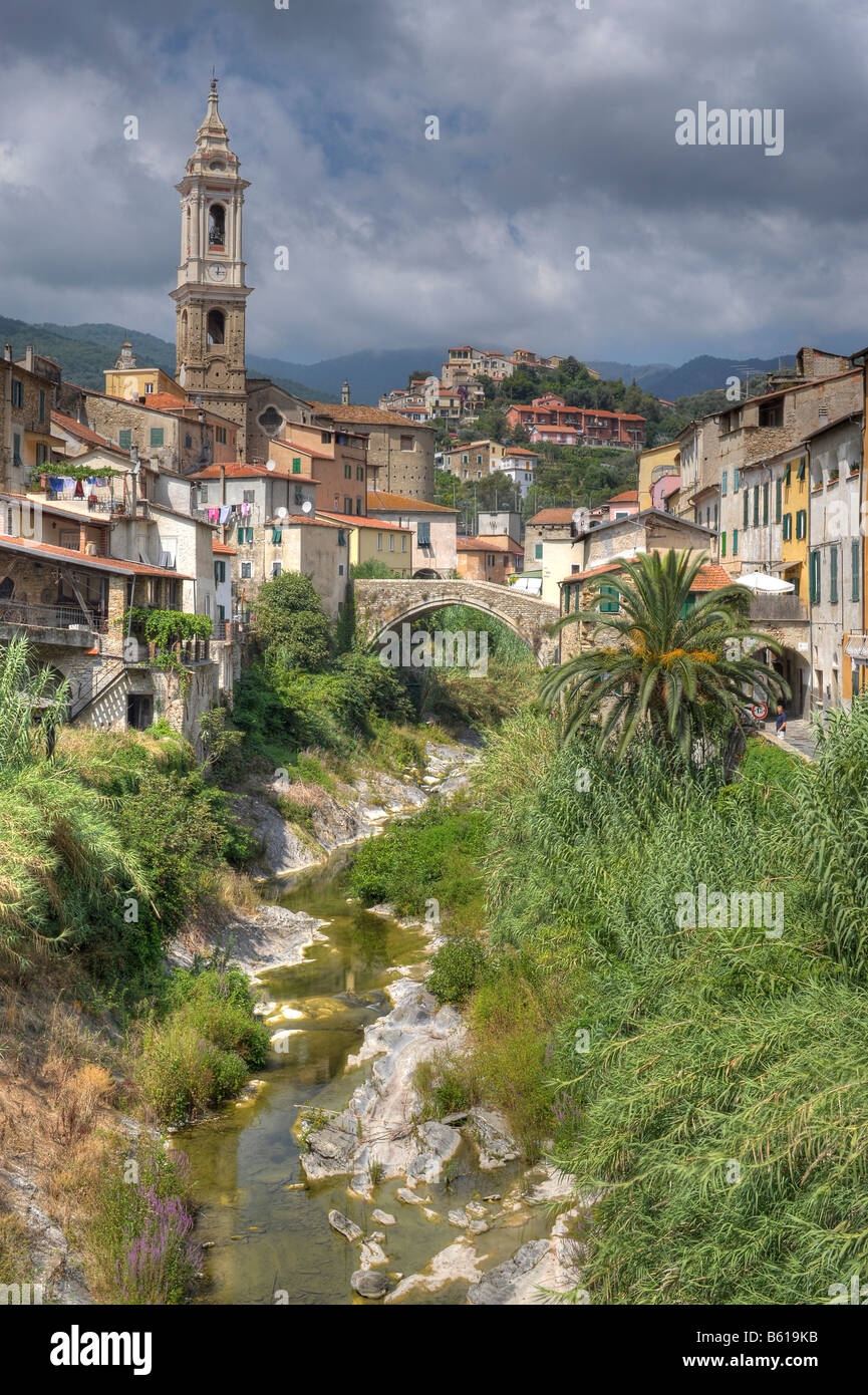 San Tomaso parish church in Dolcedo with the Ponte Grande Bridge over ...