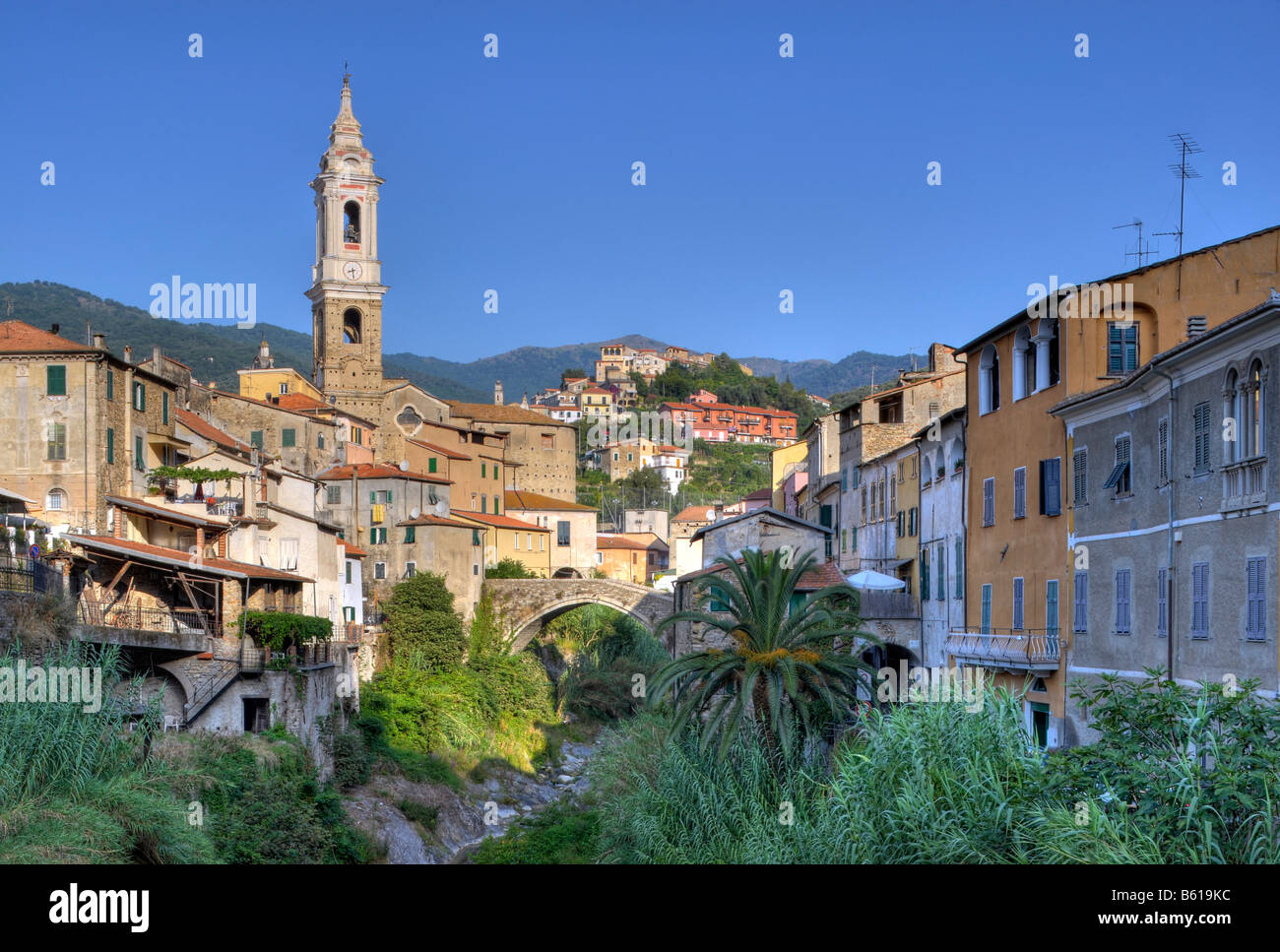 San Tomaso parish church in Dolcedo with the Ponte Grande Bridge over ...