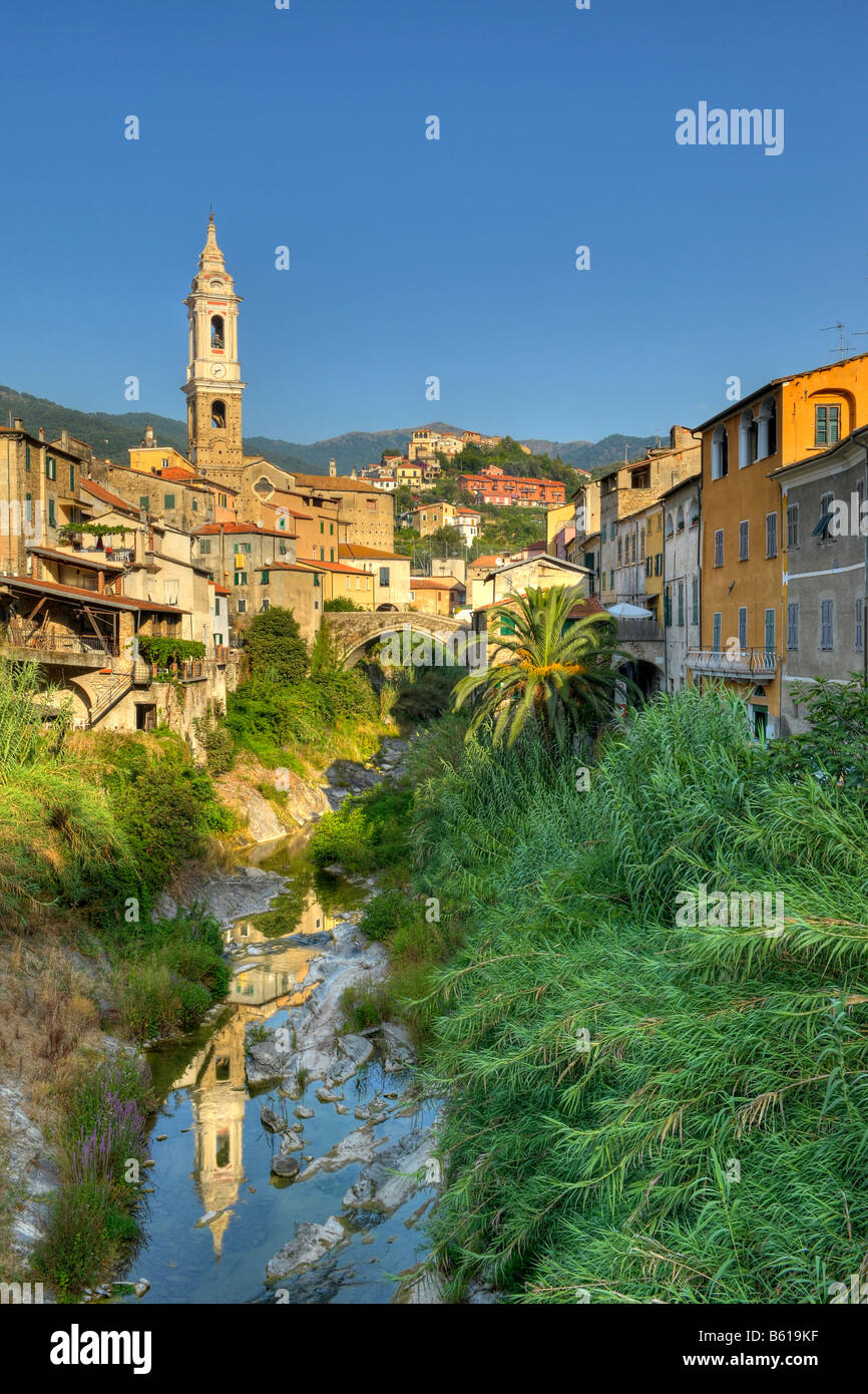 San Tomaso parish church in Dolcedo with the Ponte Grande Bridge over ...