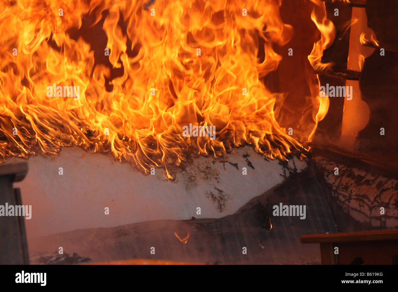 The stuffing of a couch on fire Stock Photo - Alamy