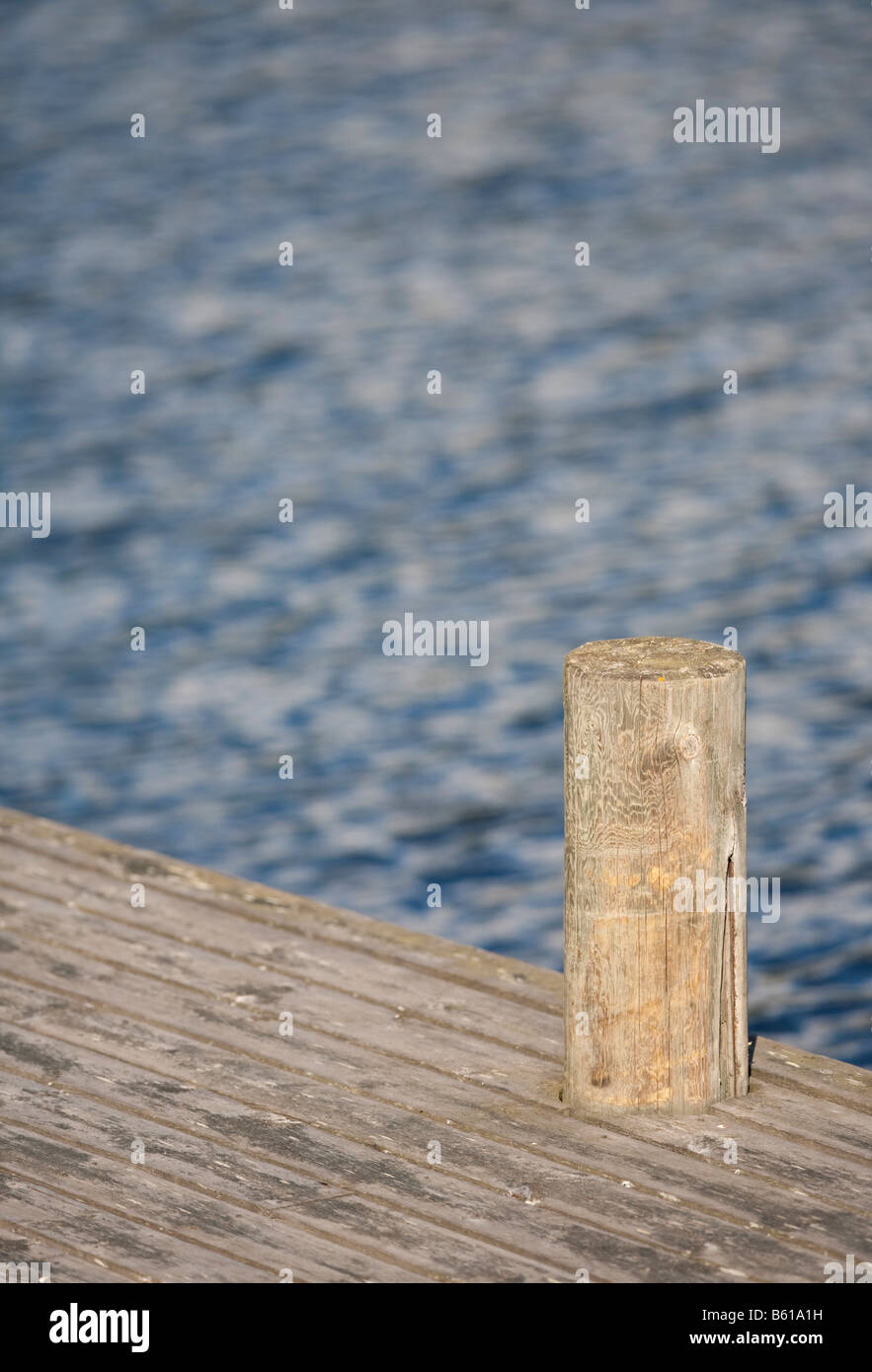 Wooden boat mooring bollard Stock Photo - Alamy