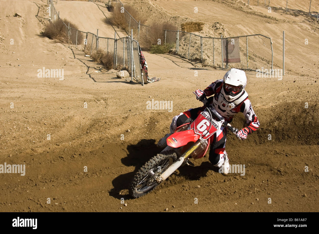 Motorcross rider sweeping through a bend at Glen Helen circuit Devore ...