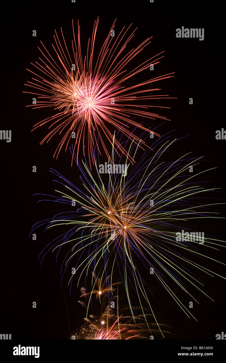 Colorful fireworks exploding in the night sky Stock Photo - Alamy