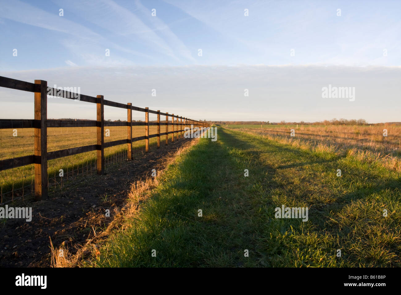 Fence Running Into The Distance Stock Photo - Alamy