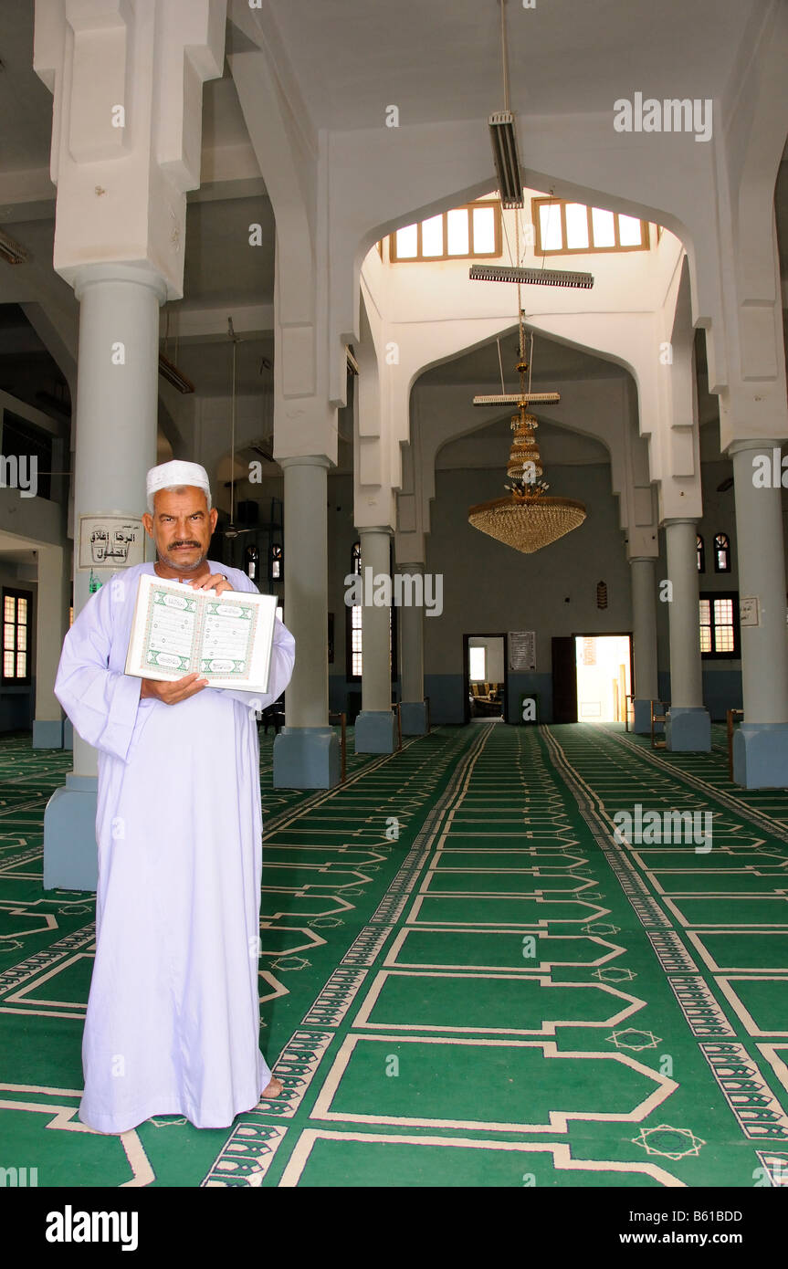 muslim holding koran in mosque Stock Photo - Alamy