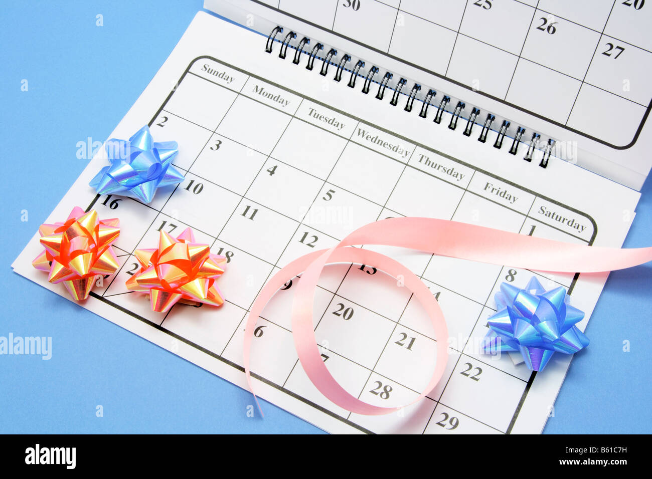 Gift Bows and Ribbon on Calendar Stock Photo - Alamy