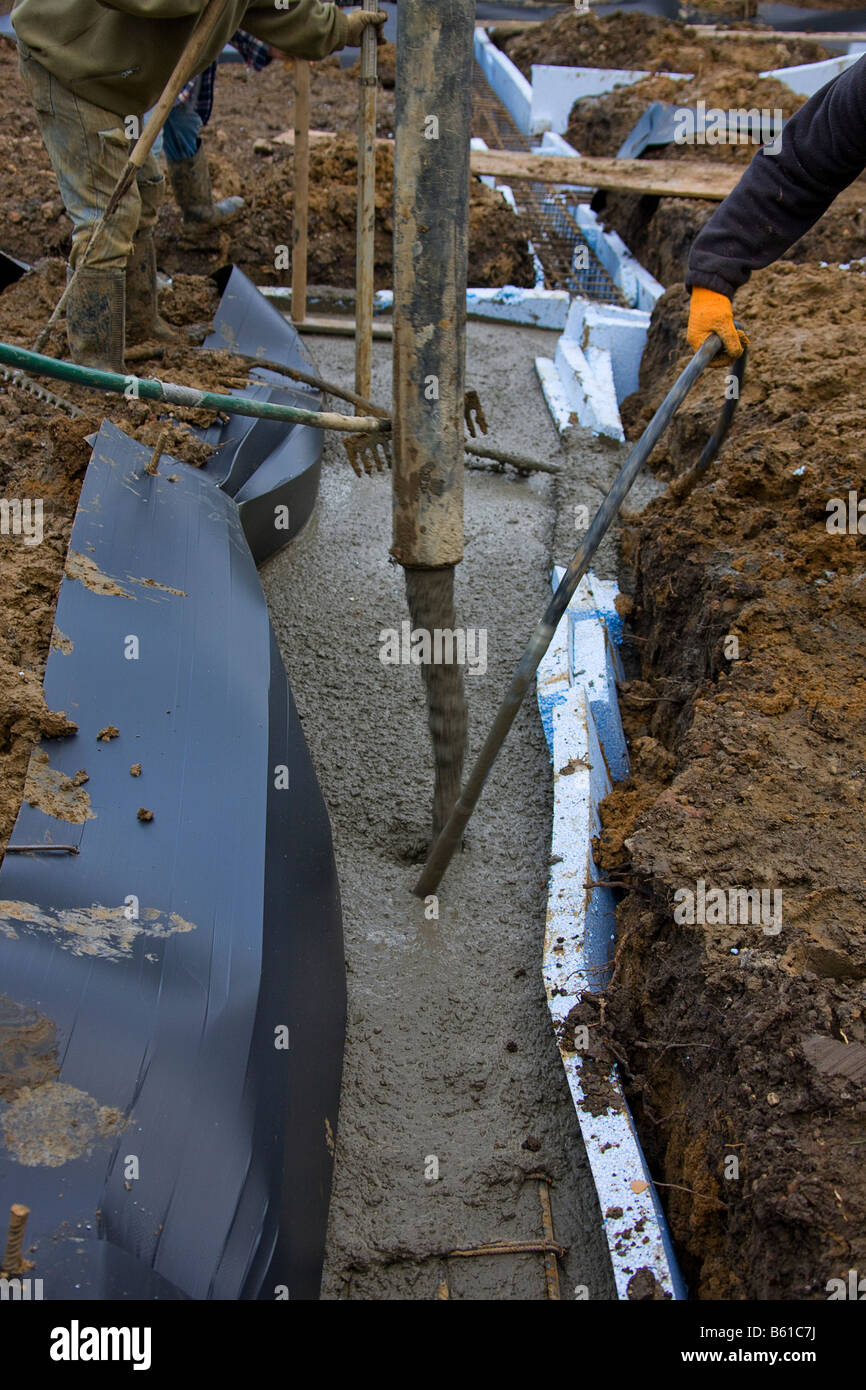 Concrete being pumped from cement pump hi-res stock photography and ...
