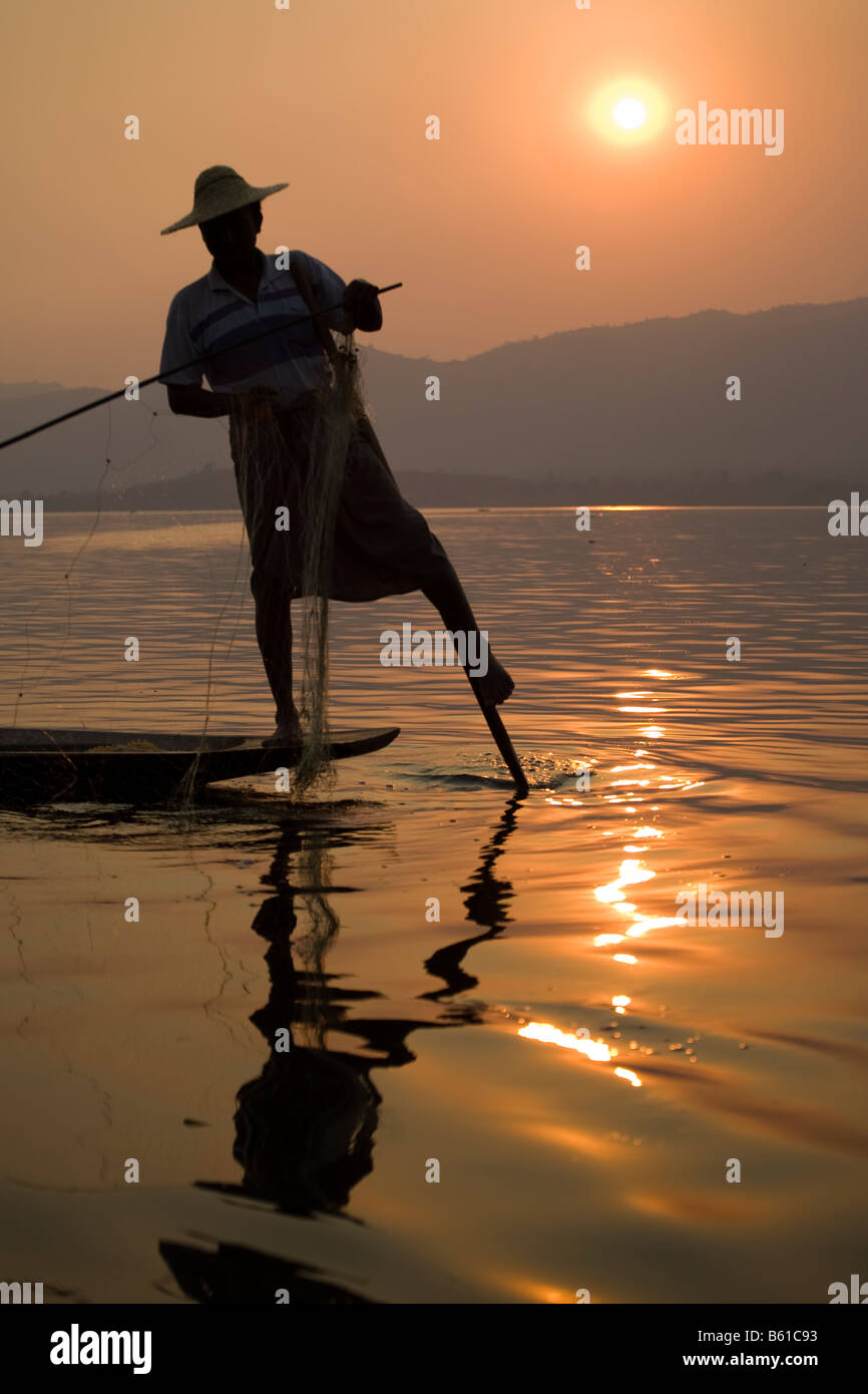 Leg rower traditional fishing at the sunset Inle Lake Myanmar Asia ...